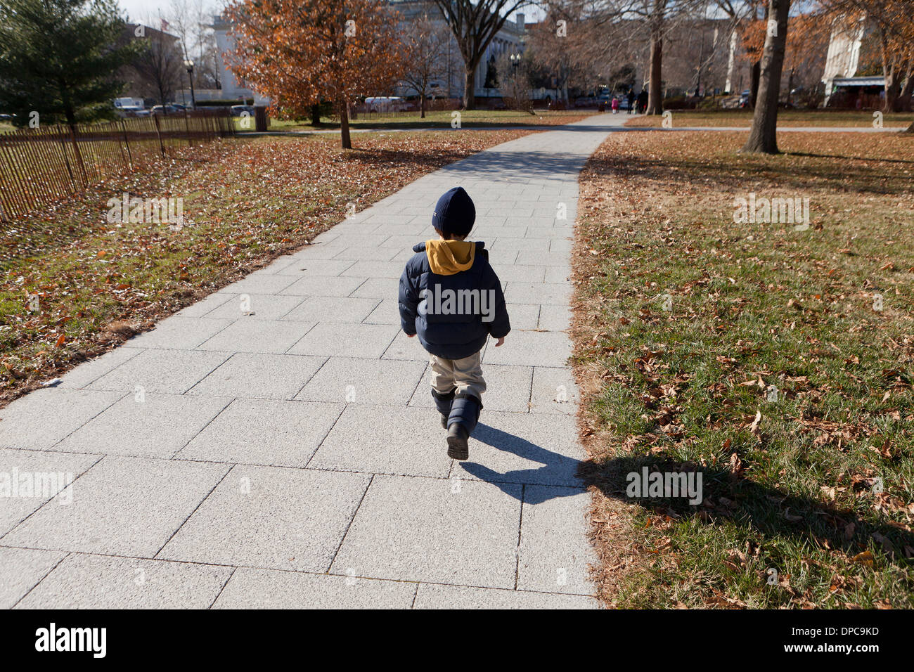 Boy walking on path Stock Photo - Alamy
