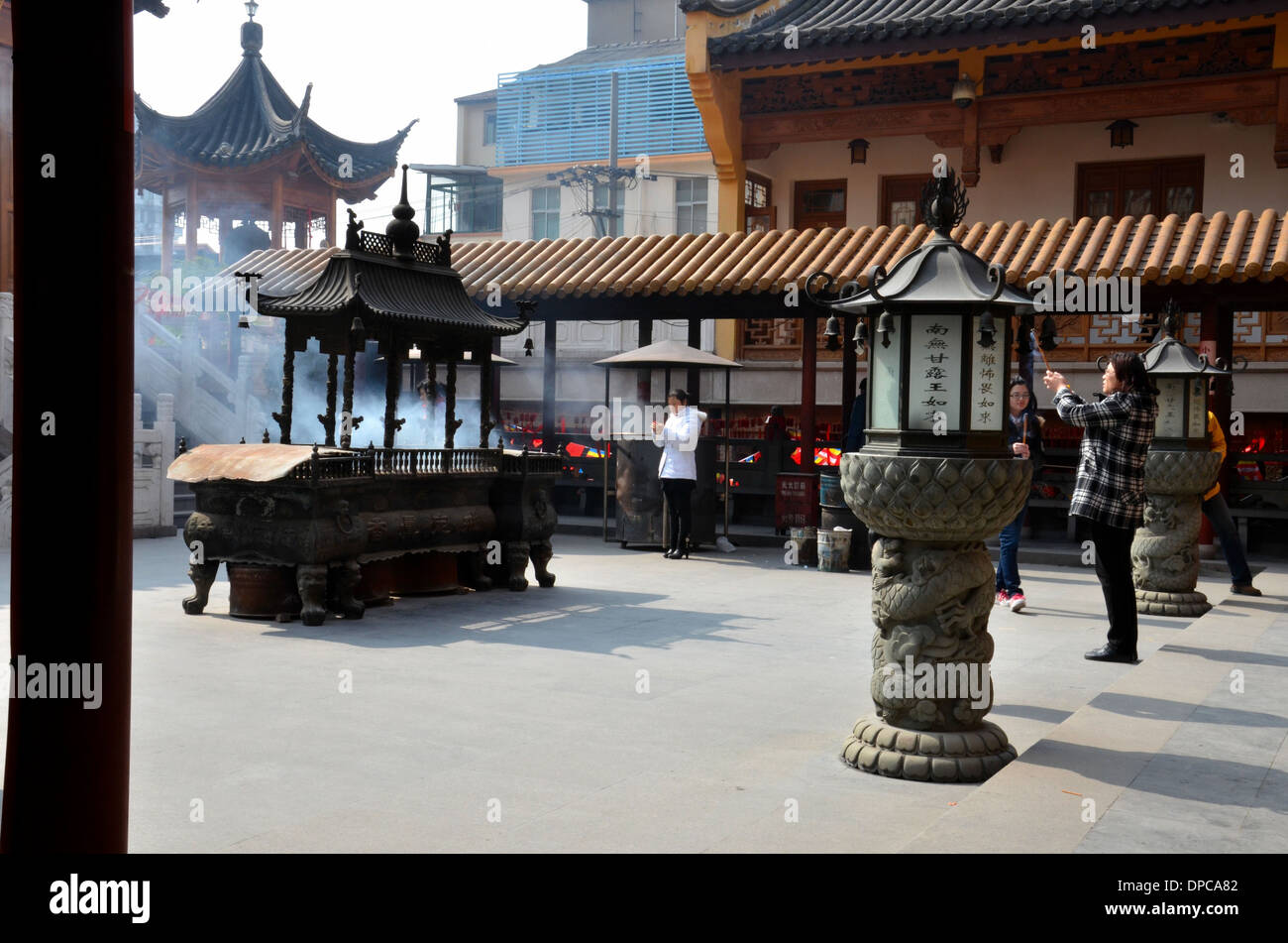 Chinese women pray at temple courtyard Shanghai China Stock Photo - Alamy
