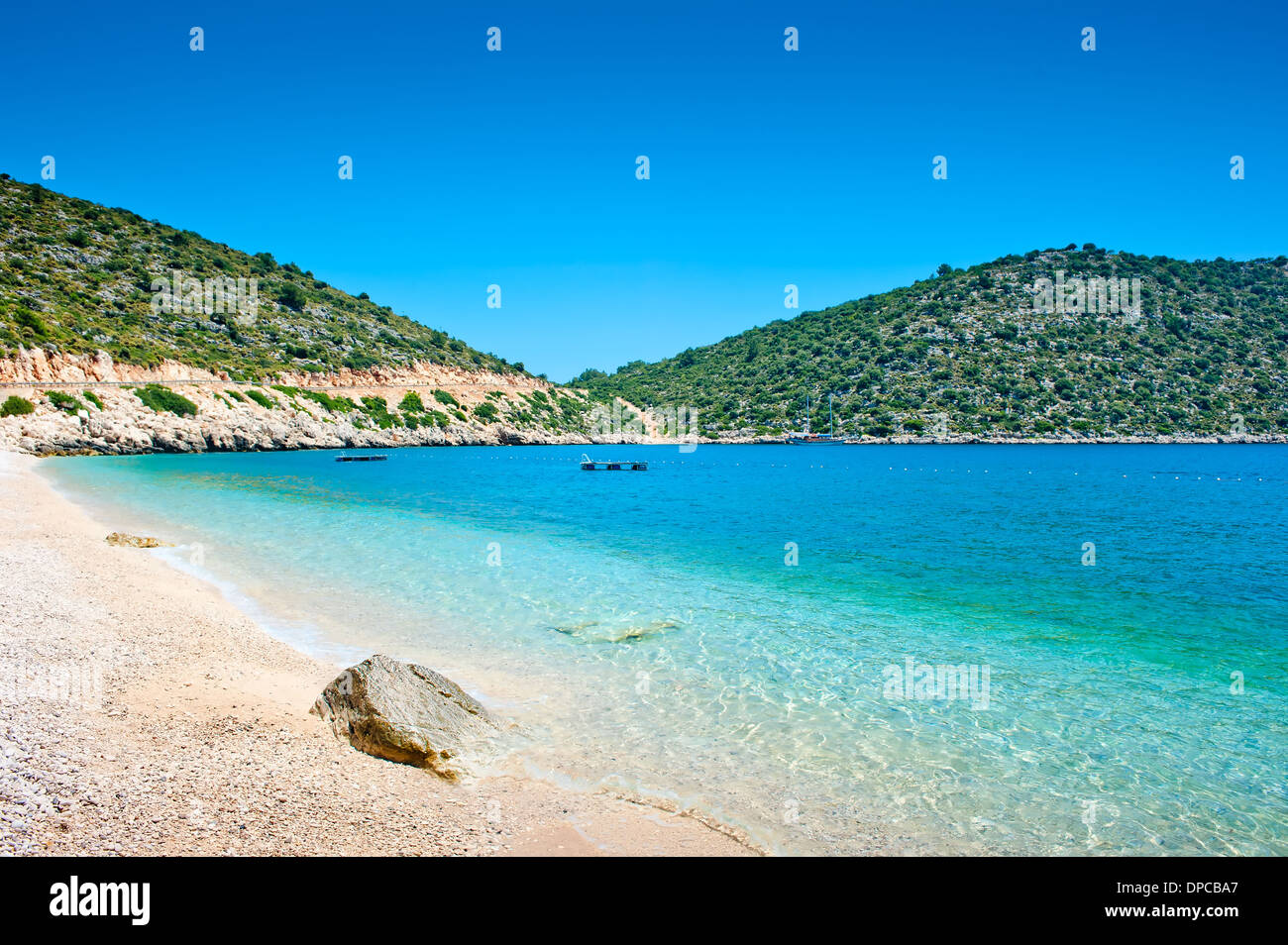 sea cove surrounded by mountains with green vegetation Stock Photo - Alamy