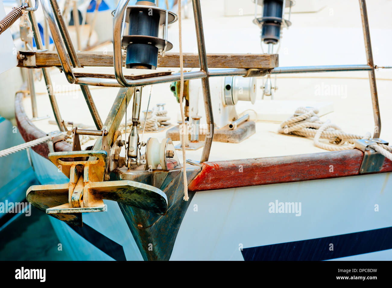 Rusty anchor on the bow deck of a yacht Stock Photo - Alamy