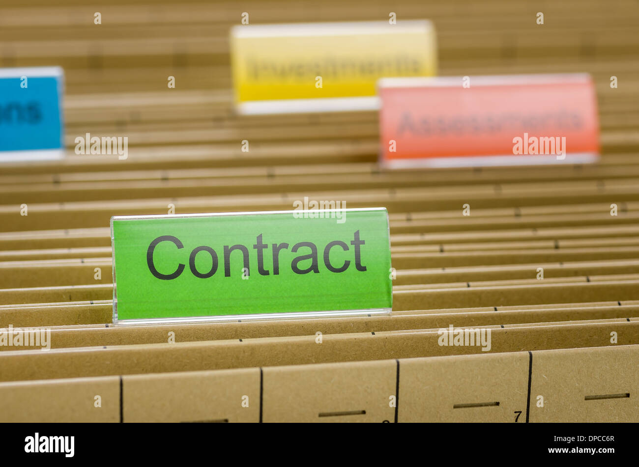 Hanging file folder labeled with Contract Stock Photo - Alamy