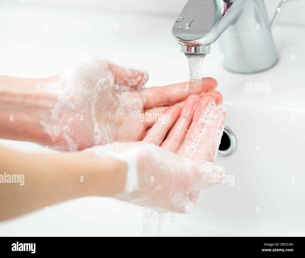 Washing arms with soap hi-res stock photography and images - Alamy