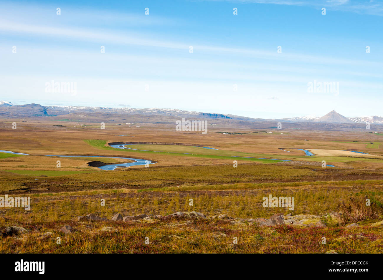 Icelandic landscape with volcanic rocks and green grass Stock Photo - Alamy