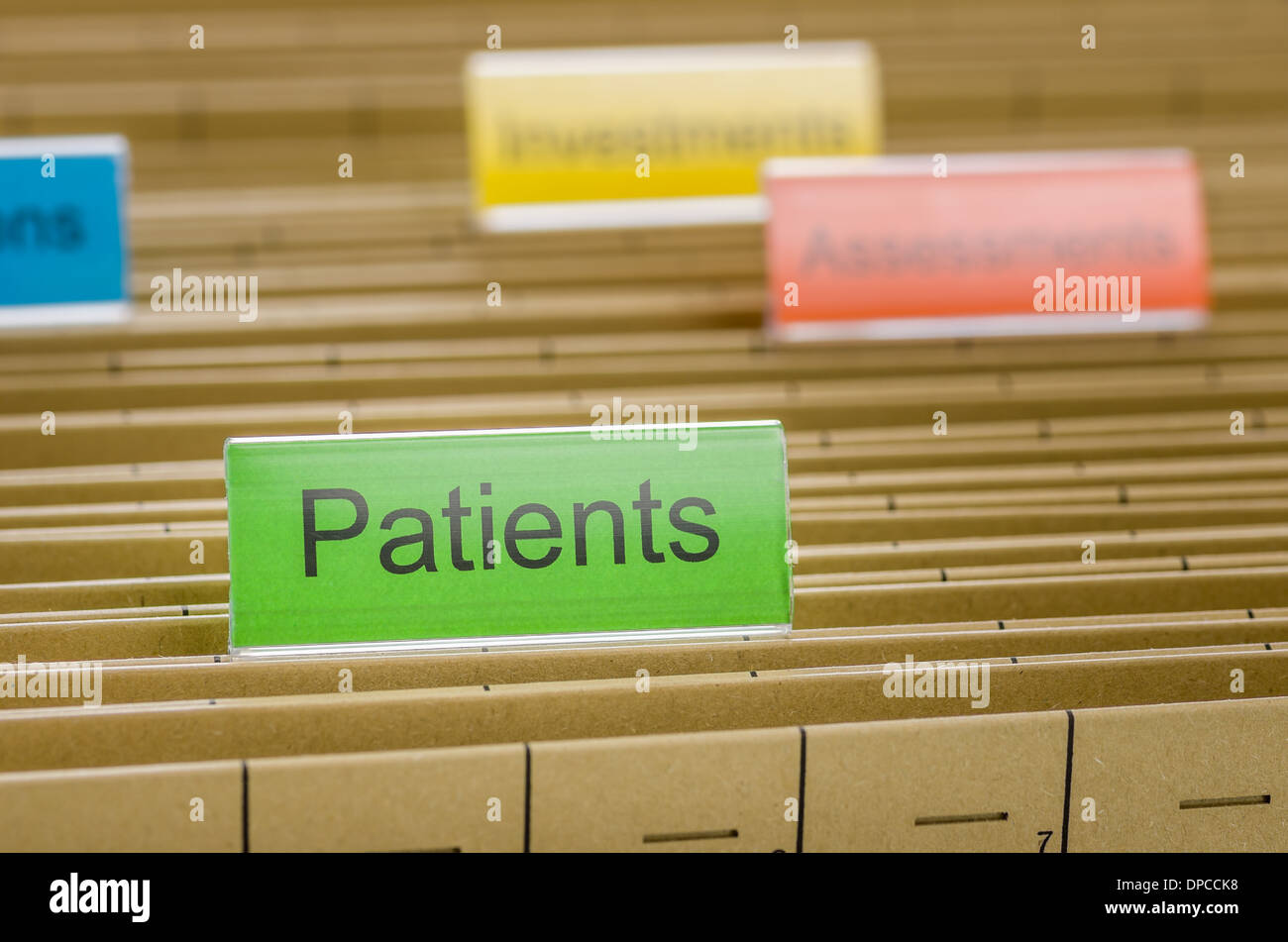 Hanging file folder labeled with Patients Stock Photo - Alamy