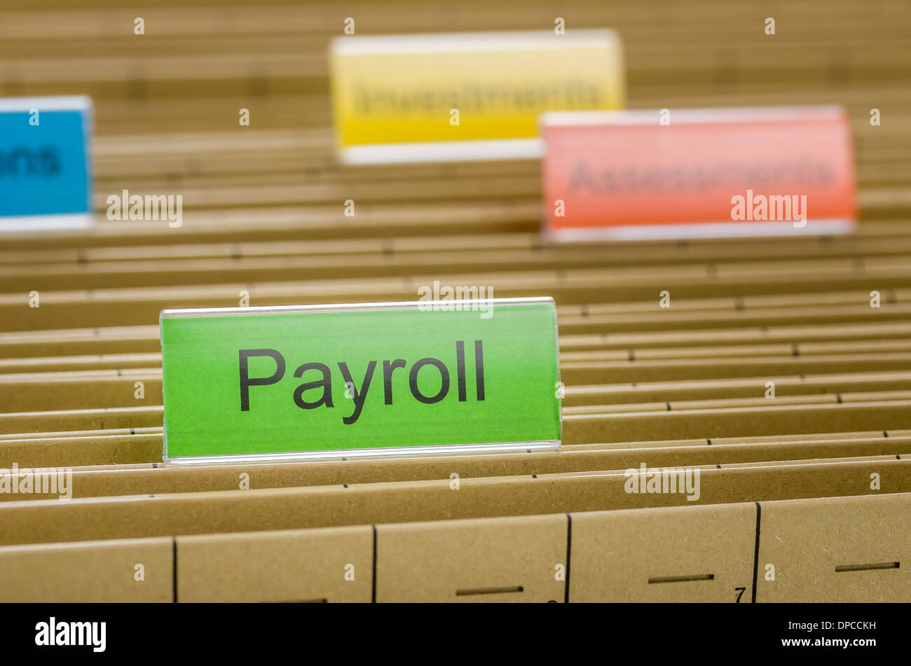 Hanging file folder labeled with Payroll Stock Photo - Alamy
