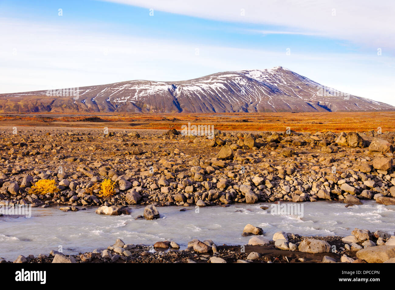 Icelandic landscape with volcanic rocks and green grass Stock Photo - Alamy