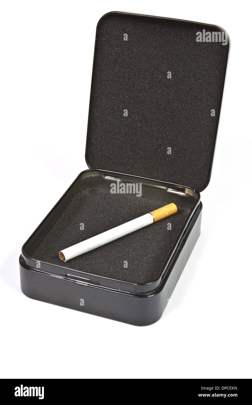 Single unlit cigarette in a black metal box Stock Photo - Alamy