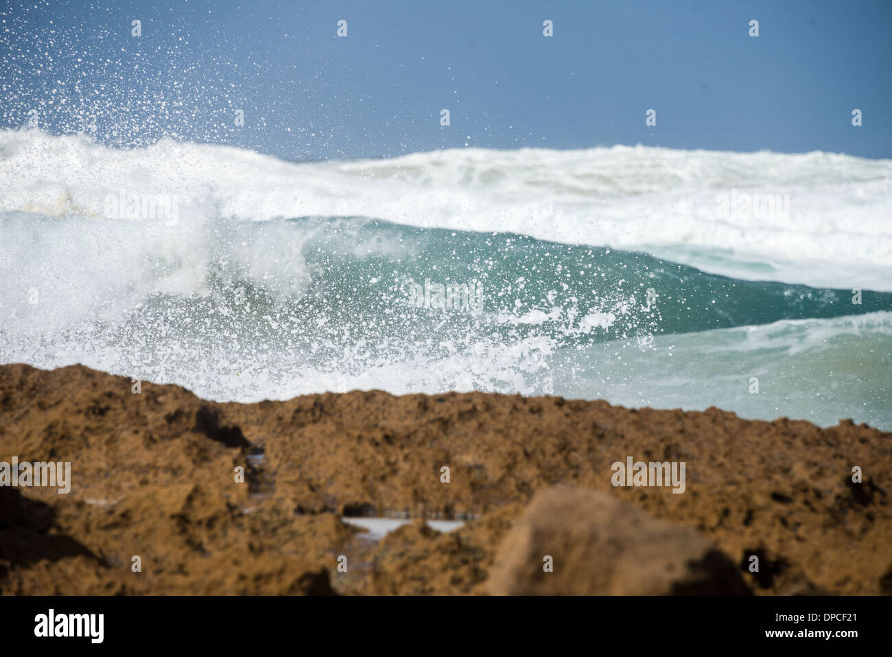 roaring ocean beach waves crashing to the shoreline taken very close up ...