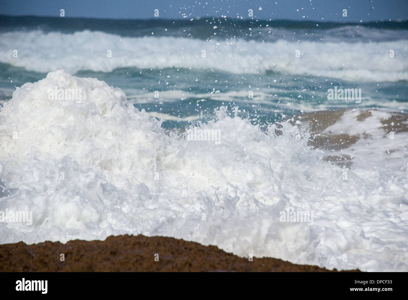 roaring ocean beach waves crashing to the shoreline taken very close up ...