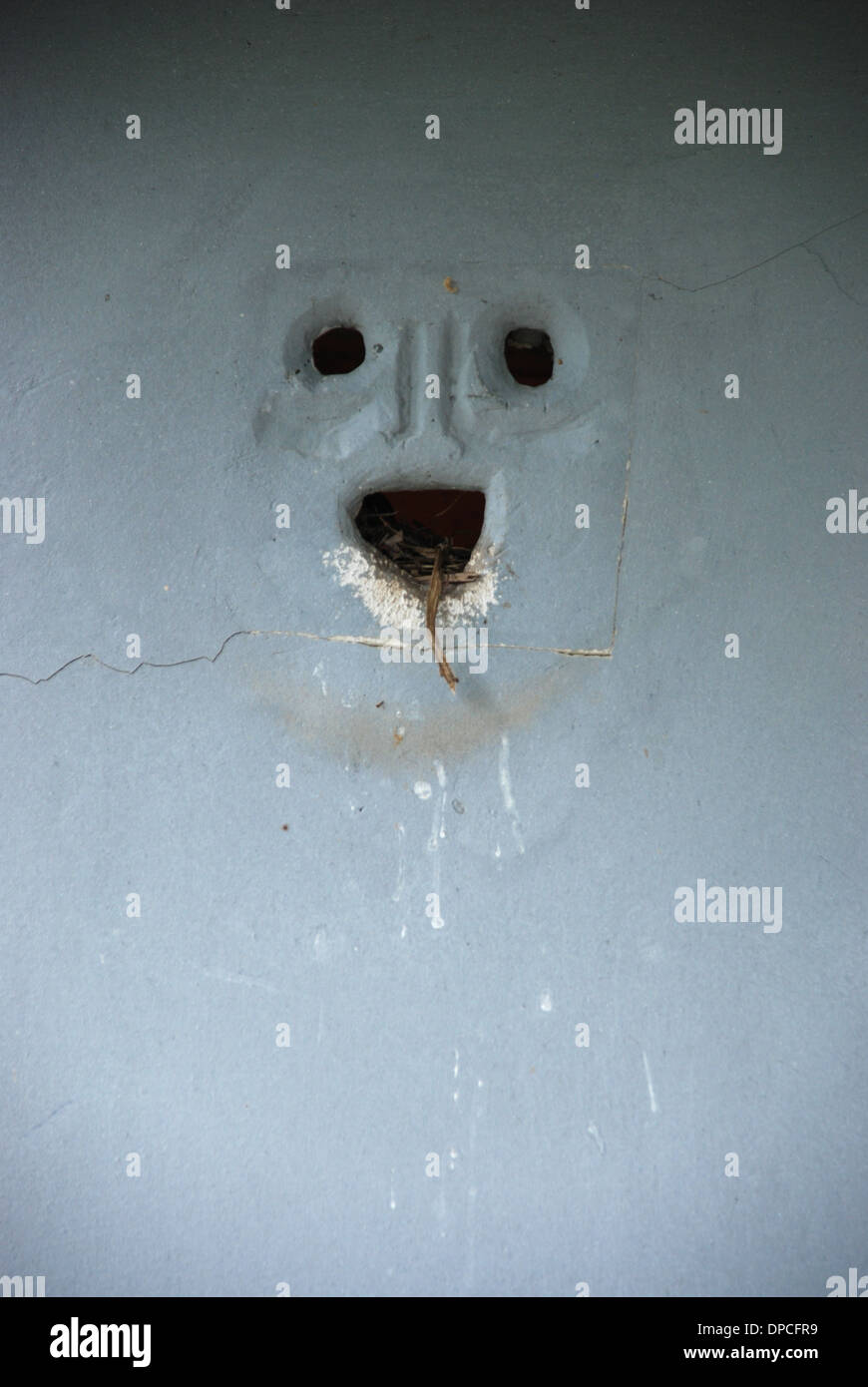 Face on the wall Stock Photo - Alamy