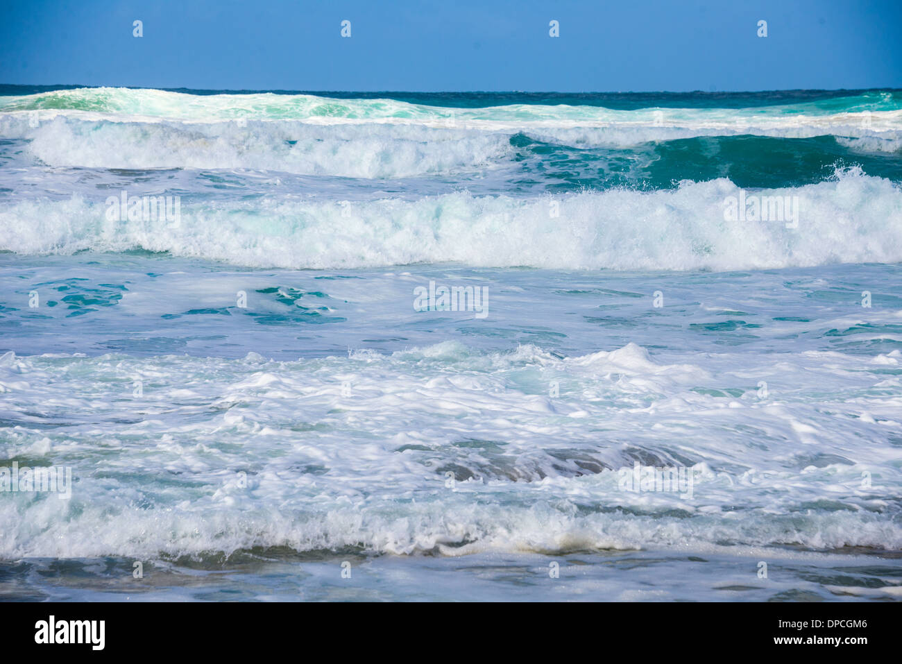 roaring ocean beach waves crashing to the shoreline taken very close up ...