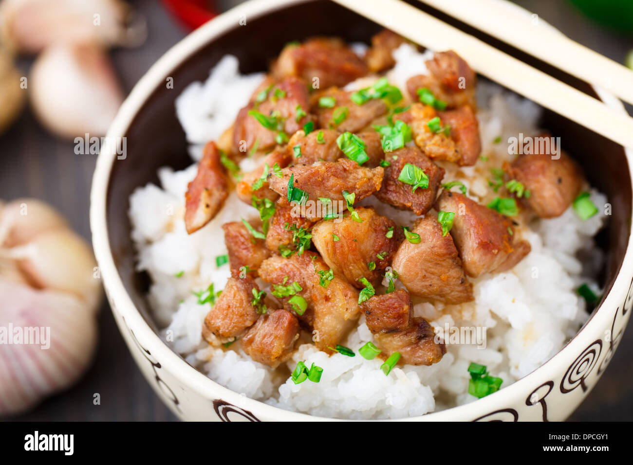 Bowl of rice with meat Stock Photo - Alamy