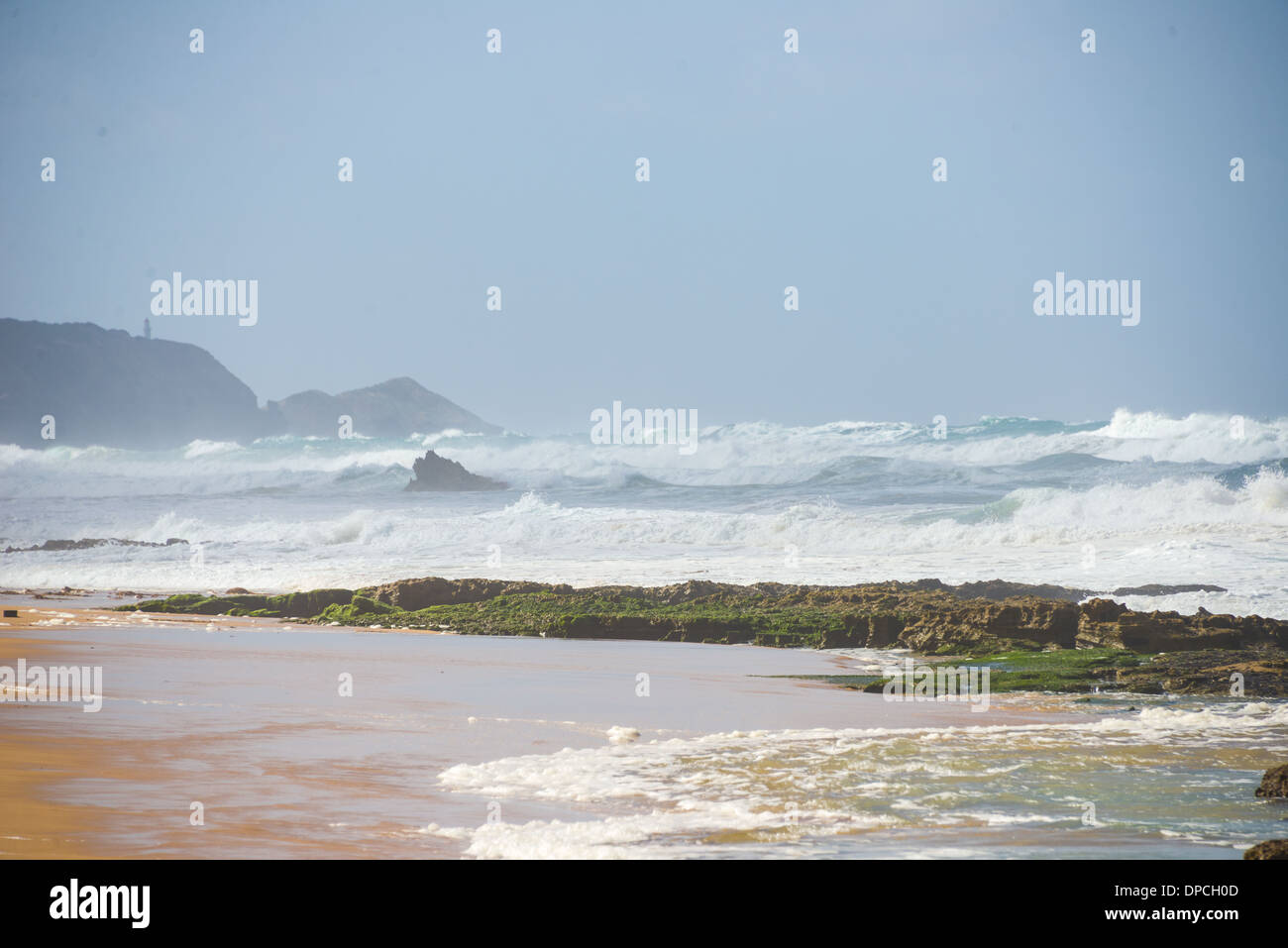 roaring ocean beach waves crashing to the shoreline taken very close up ...