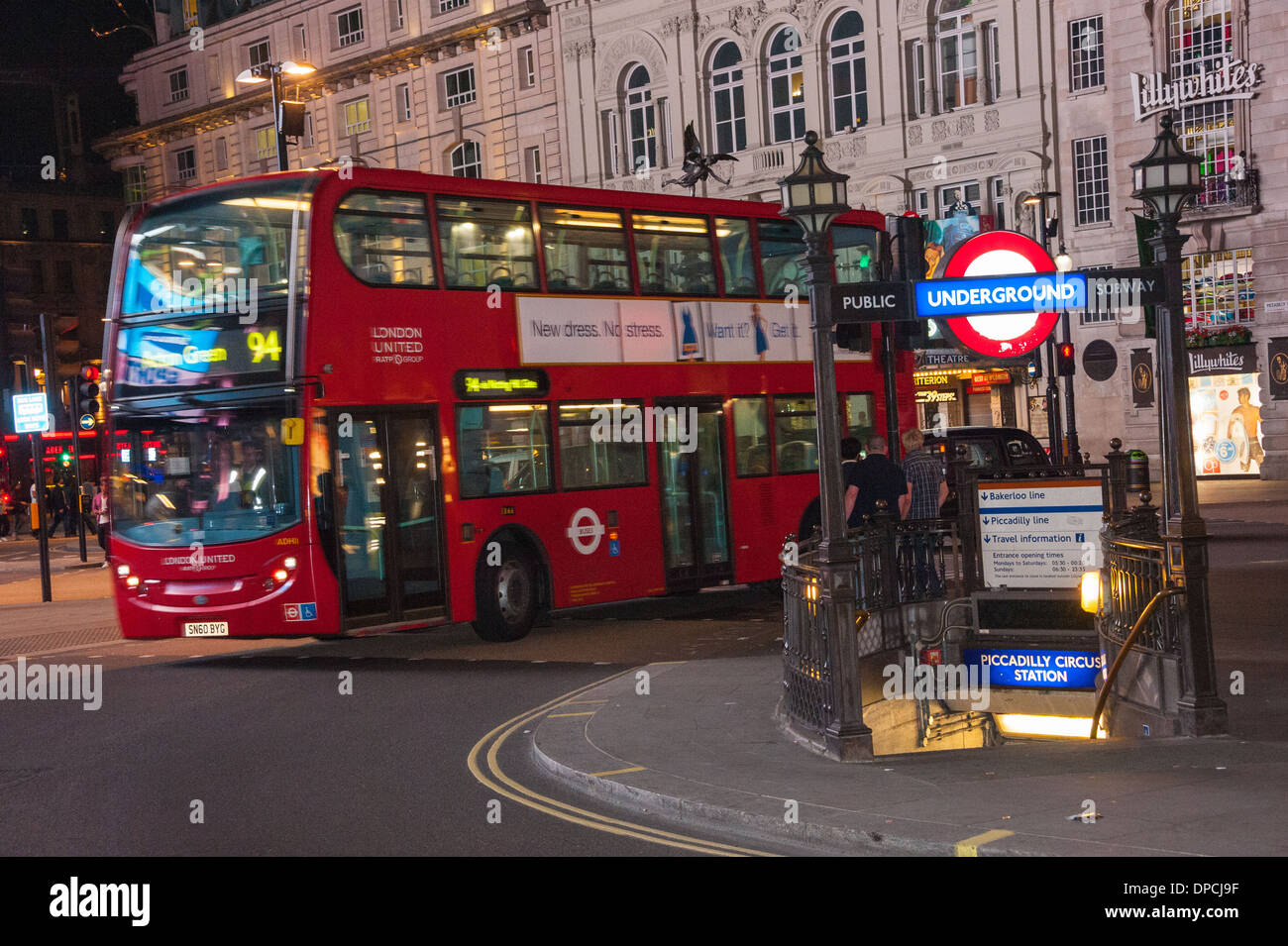 London Piccadilly circus at night with red buses and london cabs Stock ...