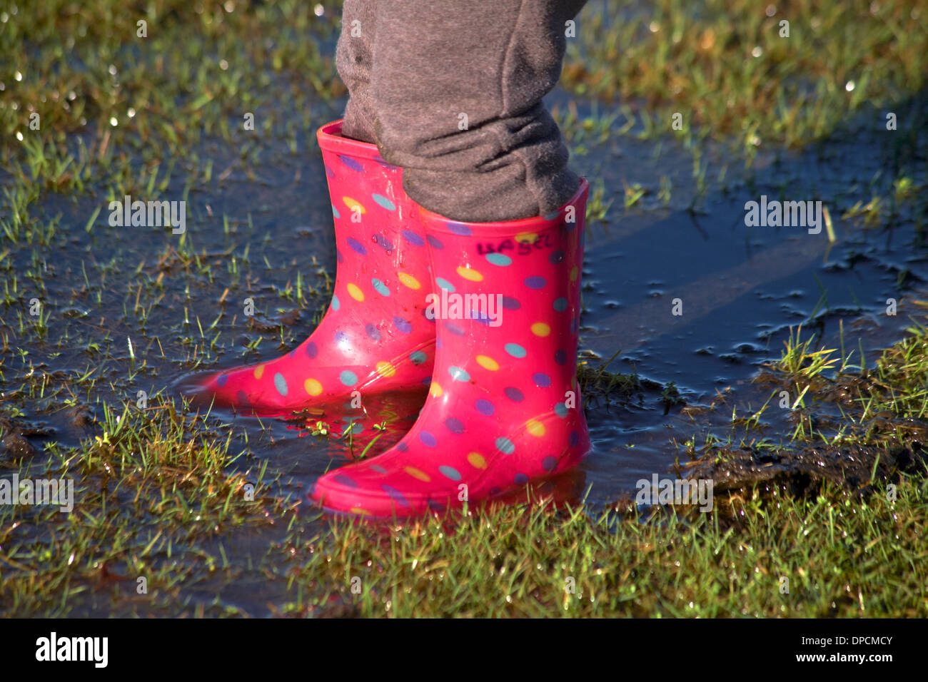 Child splashing puddles hi-res stock photography and images - Alamy