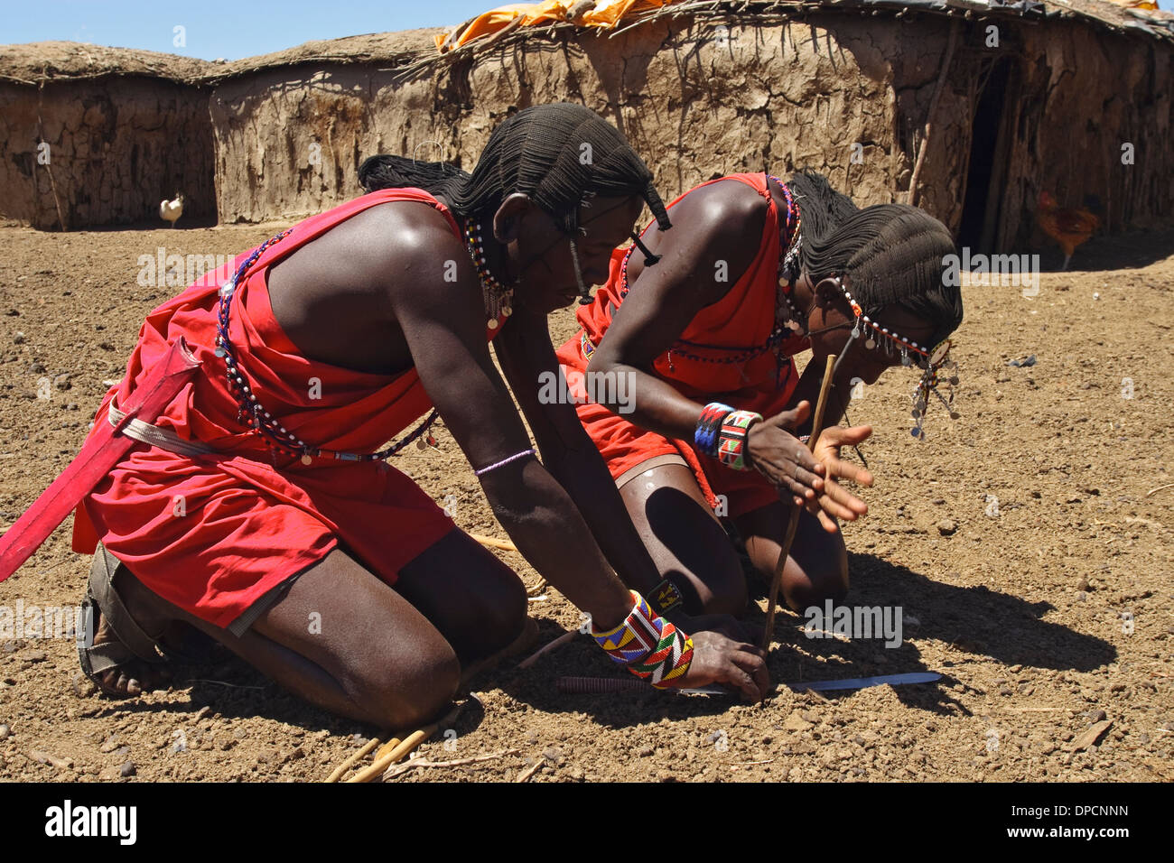 Masai men making fire Stock Photo - Alamy