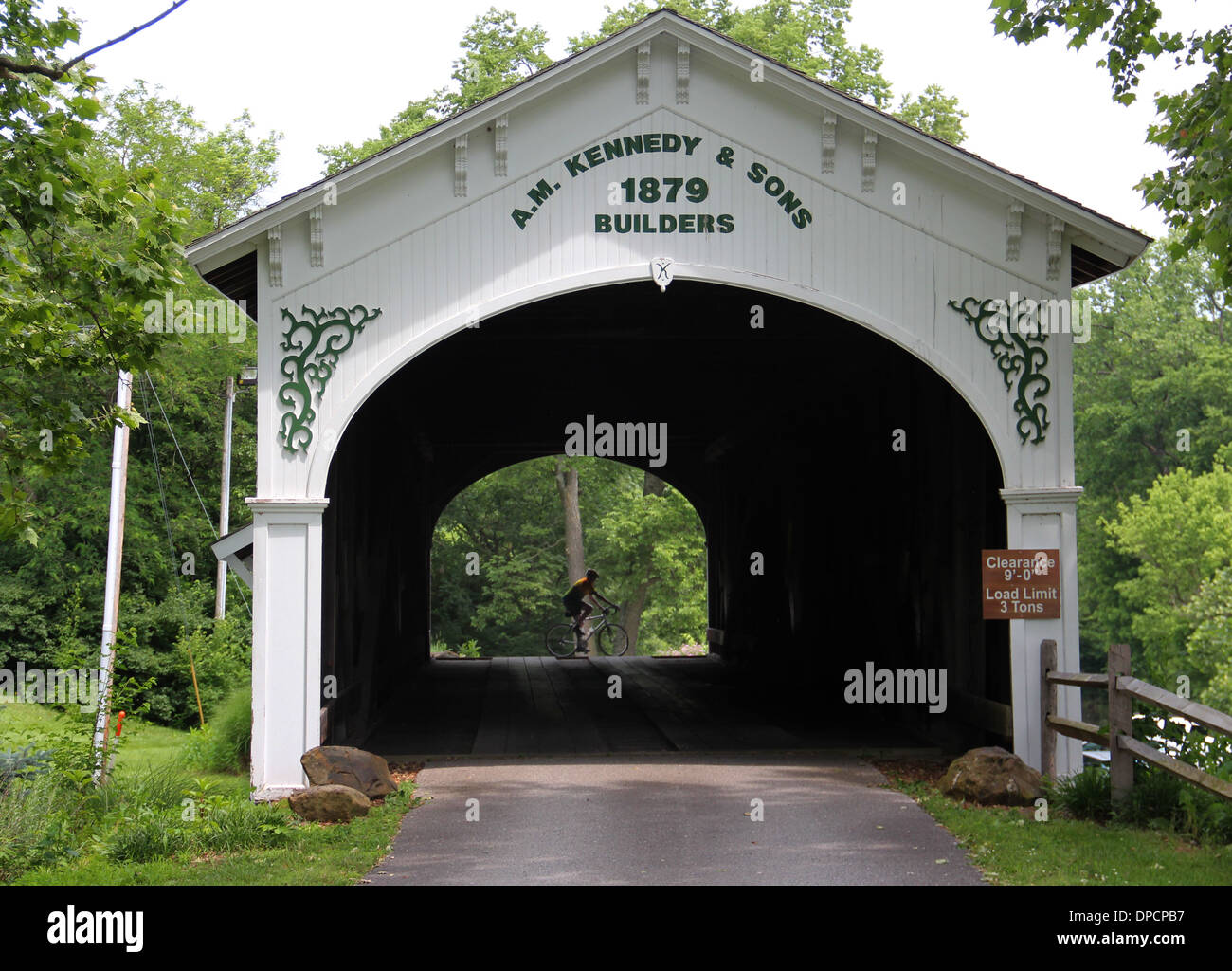 Bike ride on historic wood covered bridge Indiana Stock Photo - Alamy