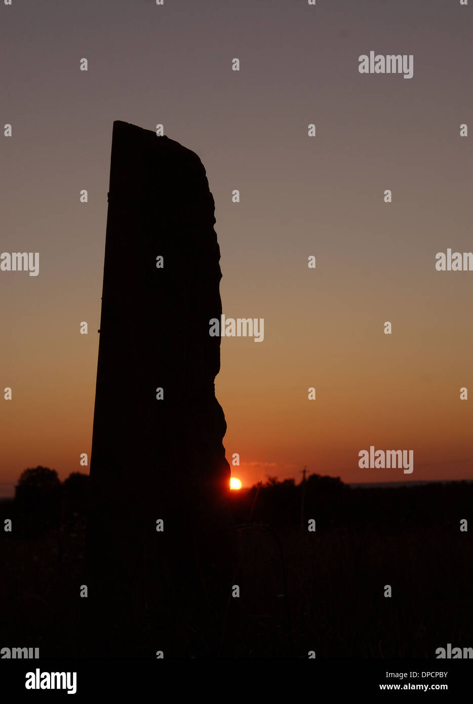 Standing stone at sunset on midsummer day Stock Photo - Alamy