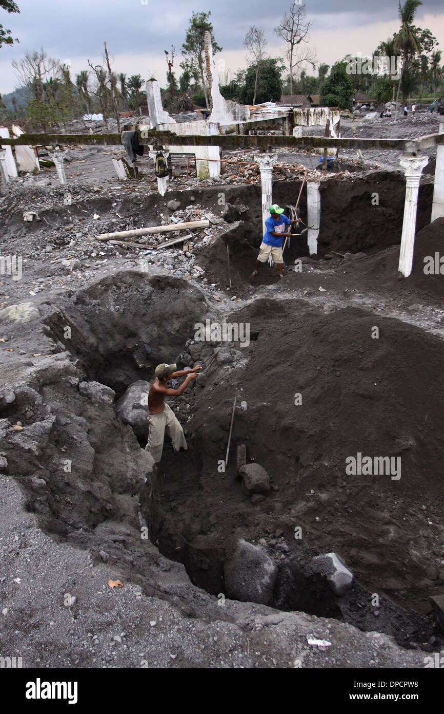 villager mining rock in Damage to village from lahar of Mt Merapi ...