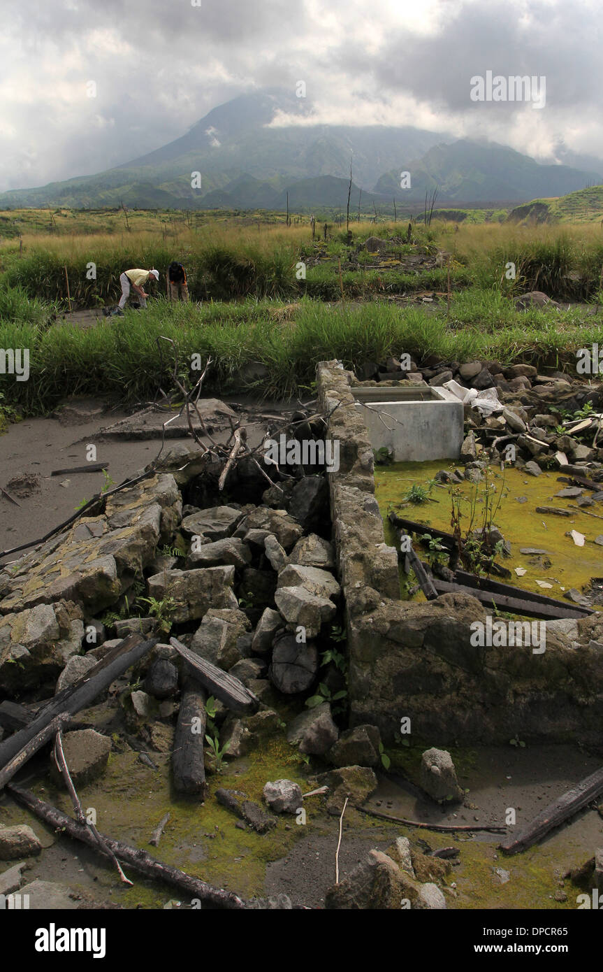Damage to village from Pyroclastic flow of Mt Merapi eruption smoking ...