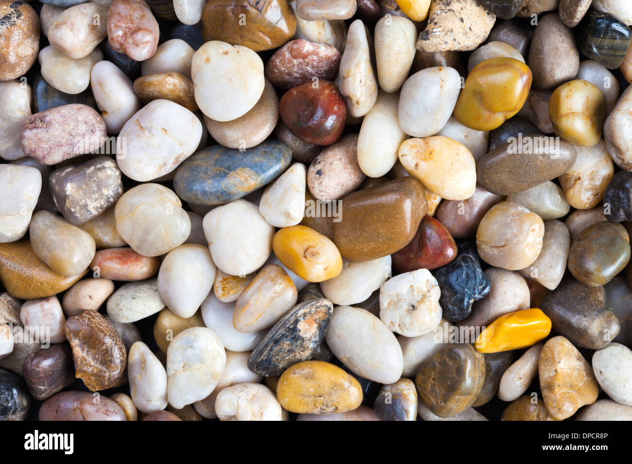 Colorful, small and smooth stones background Stock Photo - Alamy