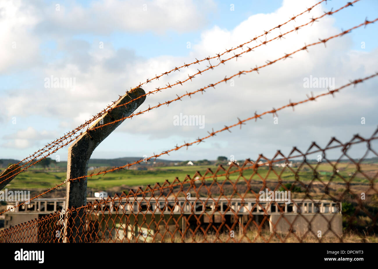 a barbed wire security fence Stock Photo - Alamy