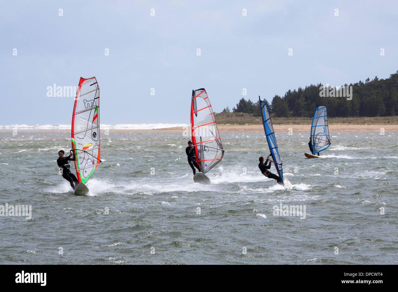 4 windsurfers enjoying their sport Stock Photo - Alamy