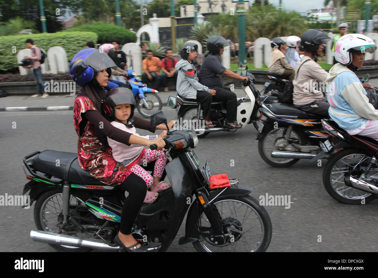 Mother and child on motorcycle Yogyakarta Indonesia Stock Photo - Alamy