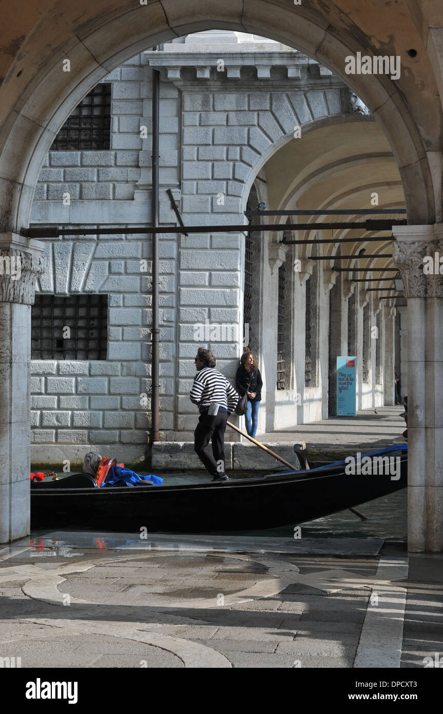 Girl standing next to bridge of sighs over a Venice canal Stock Photo ...