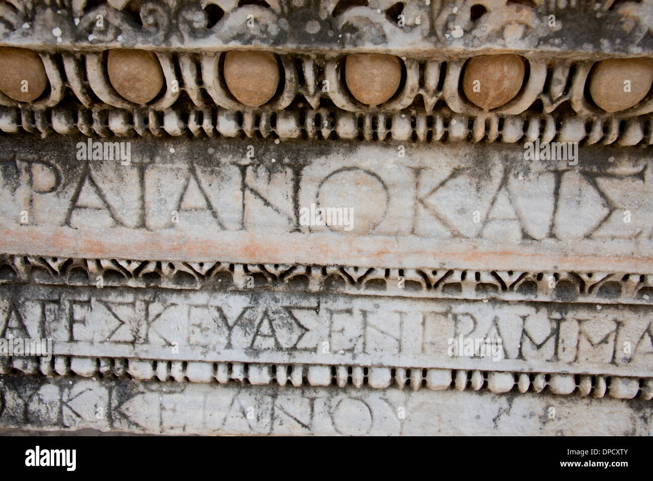Turkey, Ephesus. Ancient Ephesian ruins, marble carved text with dart ...