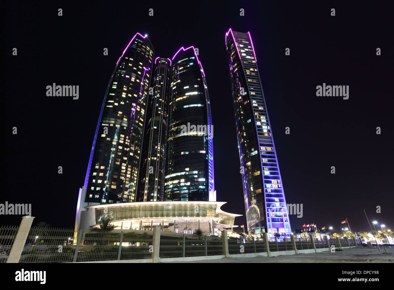 The Etihad Towers illuminated at night. Abu Dhabi, United Arab Emirates ...