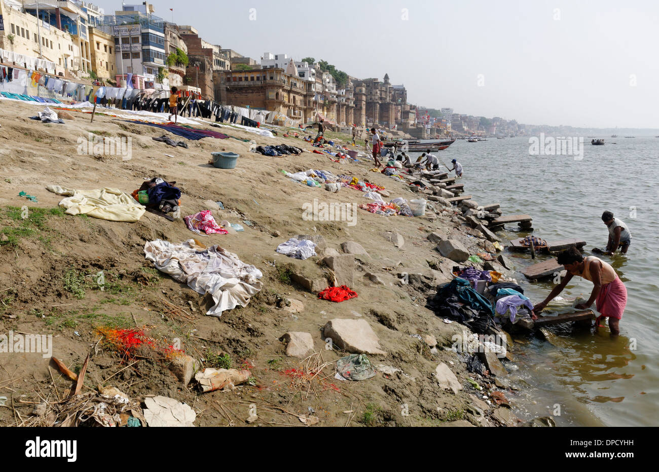 Wsahing clothes on the ghats on the banks of the Ganges at Varanasi ...