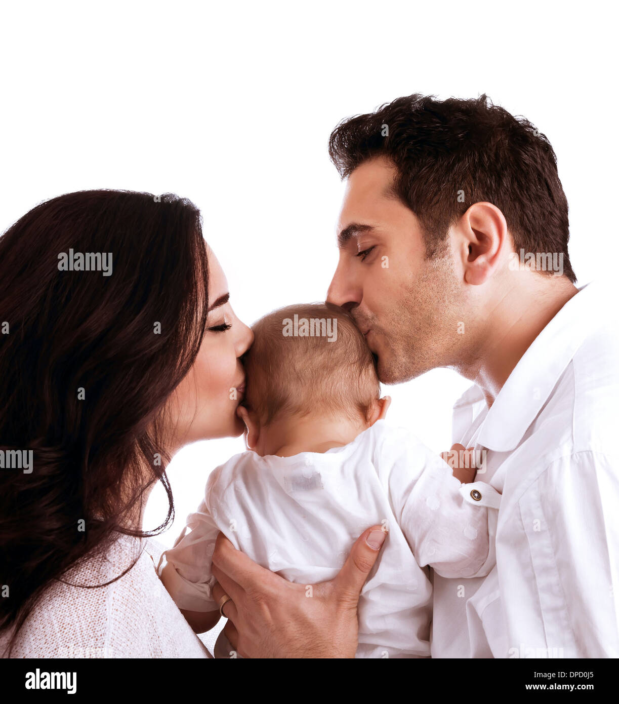 Gentle loving family, young parents kissing sweet little child ...