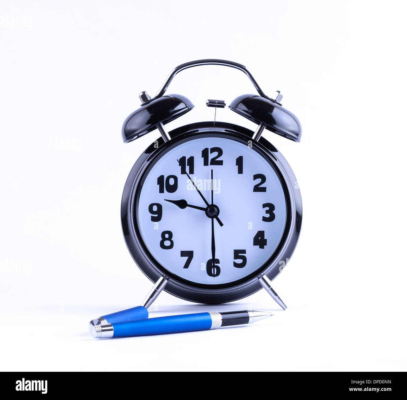 Alram clock on white background with pen Stock Photo - Alamy