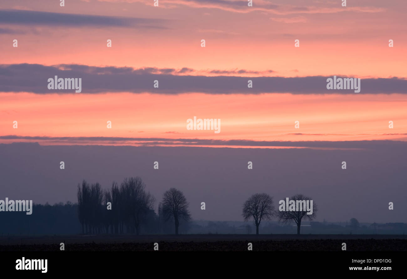 sunset with colorful sky over field Stock Photo - Alamy