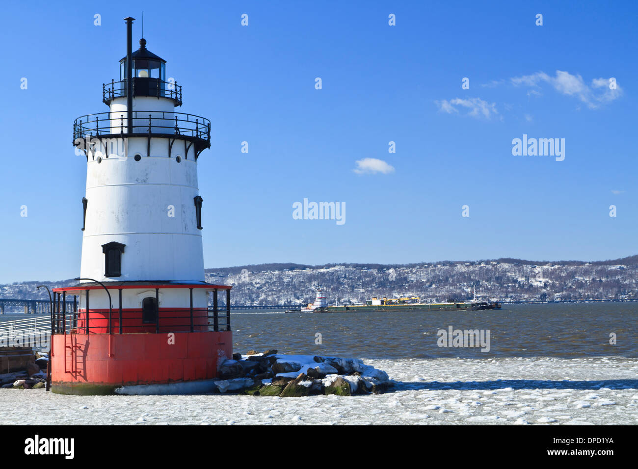 A barge head sup the icy Hudson River behind the Sleepy Hollow ...