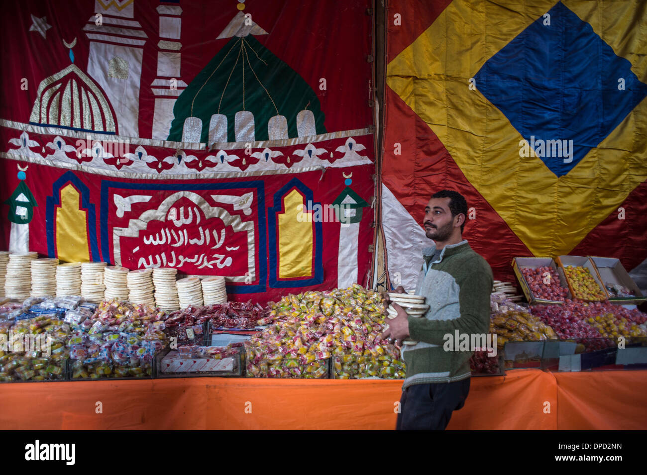 Cairo. 12th Jan, 2014. A vendor arranges candies to sell on a local ...