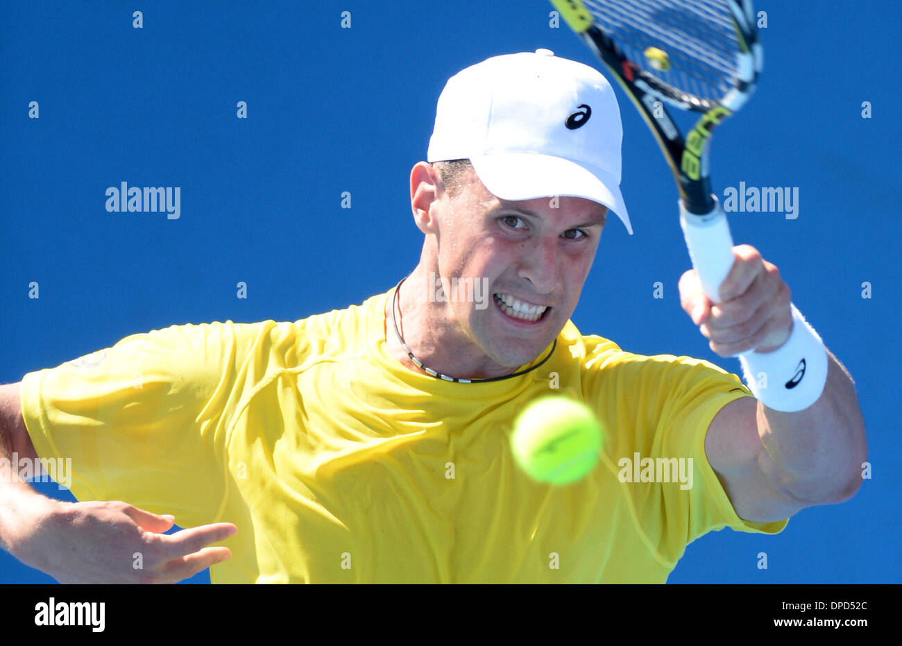 Melbourne, Australia. 13th Jan, 2014. France's Kenny De Schepper plays ...