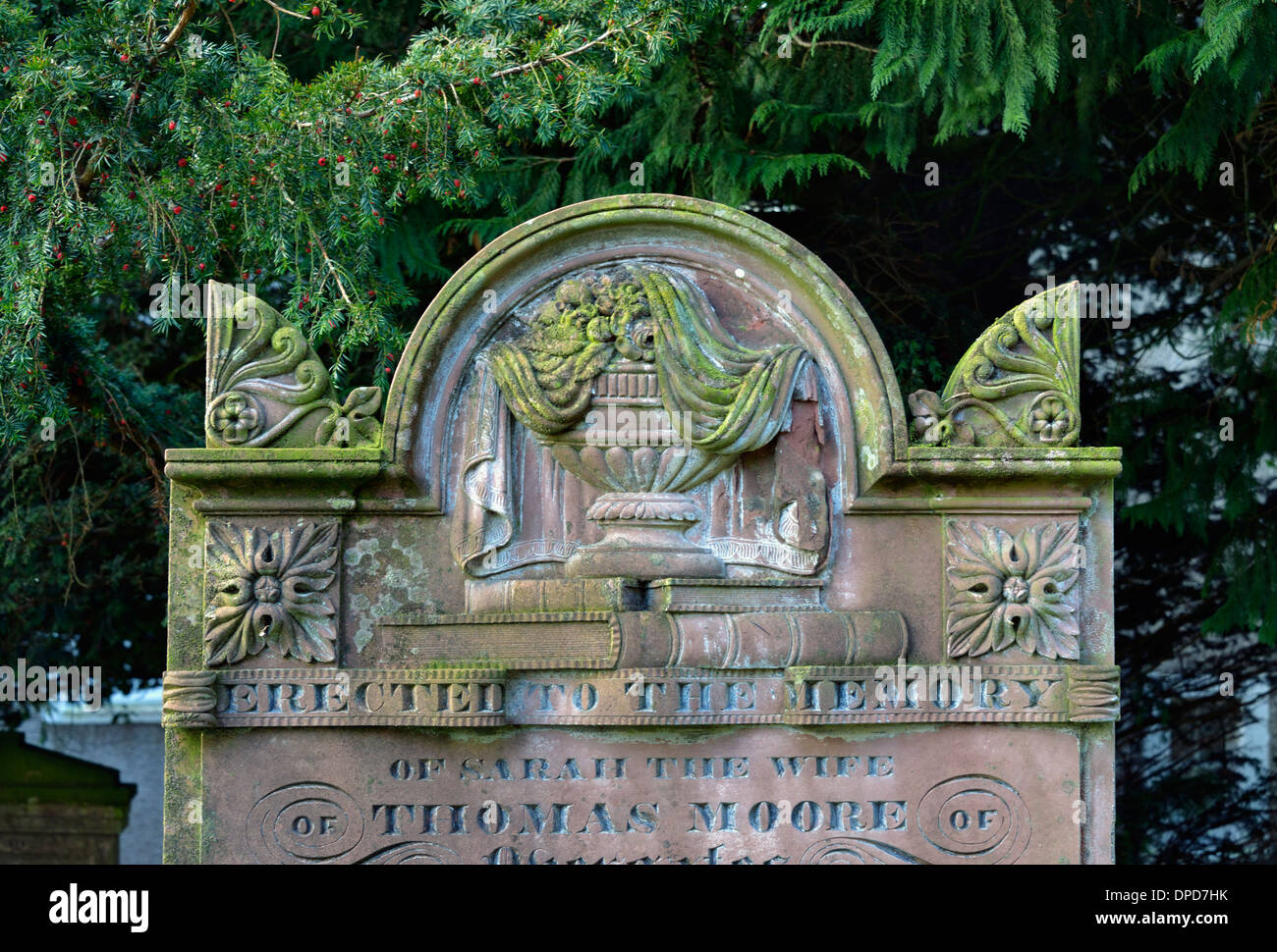 Gravestone with draped urn and book design. Church of Saint Michael ...