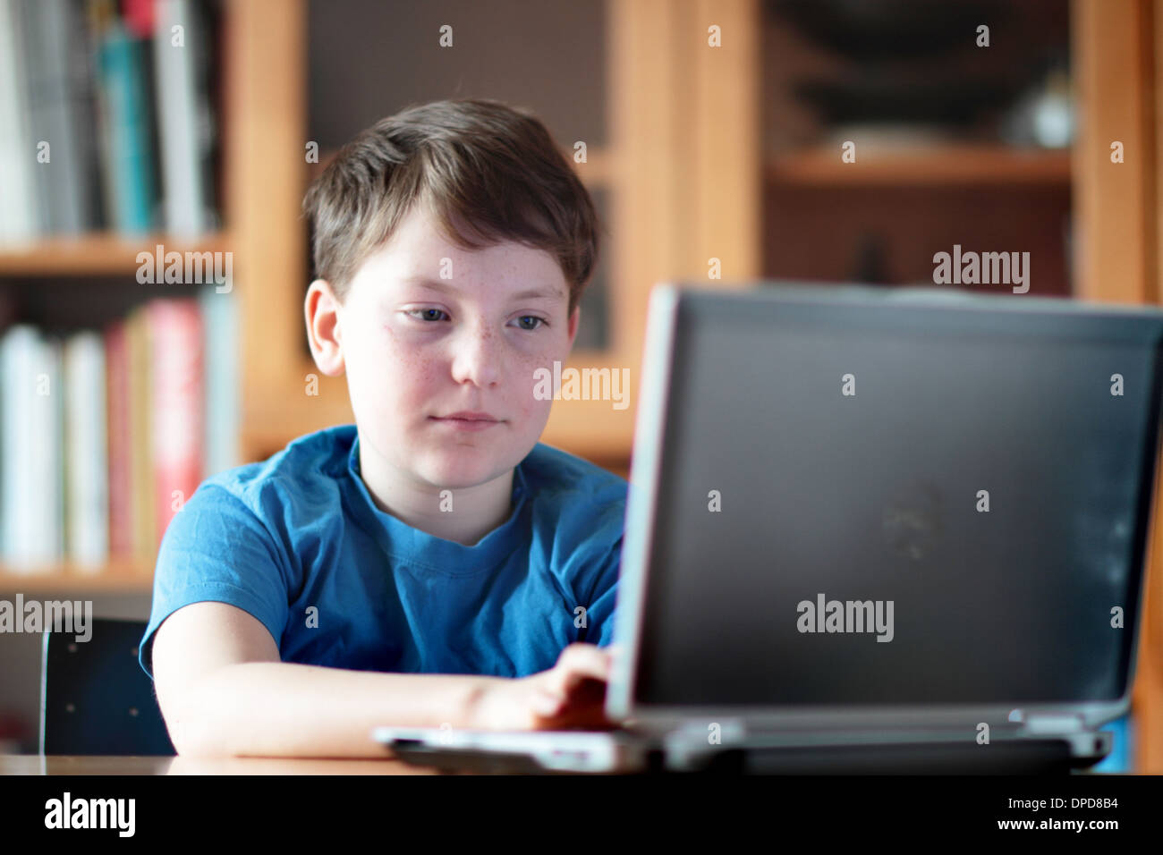 boy typing on a laptop at school Stock Photo - Alamy