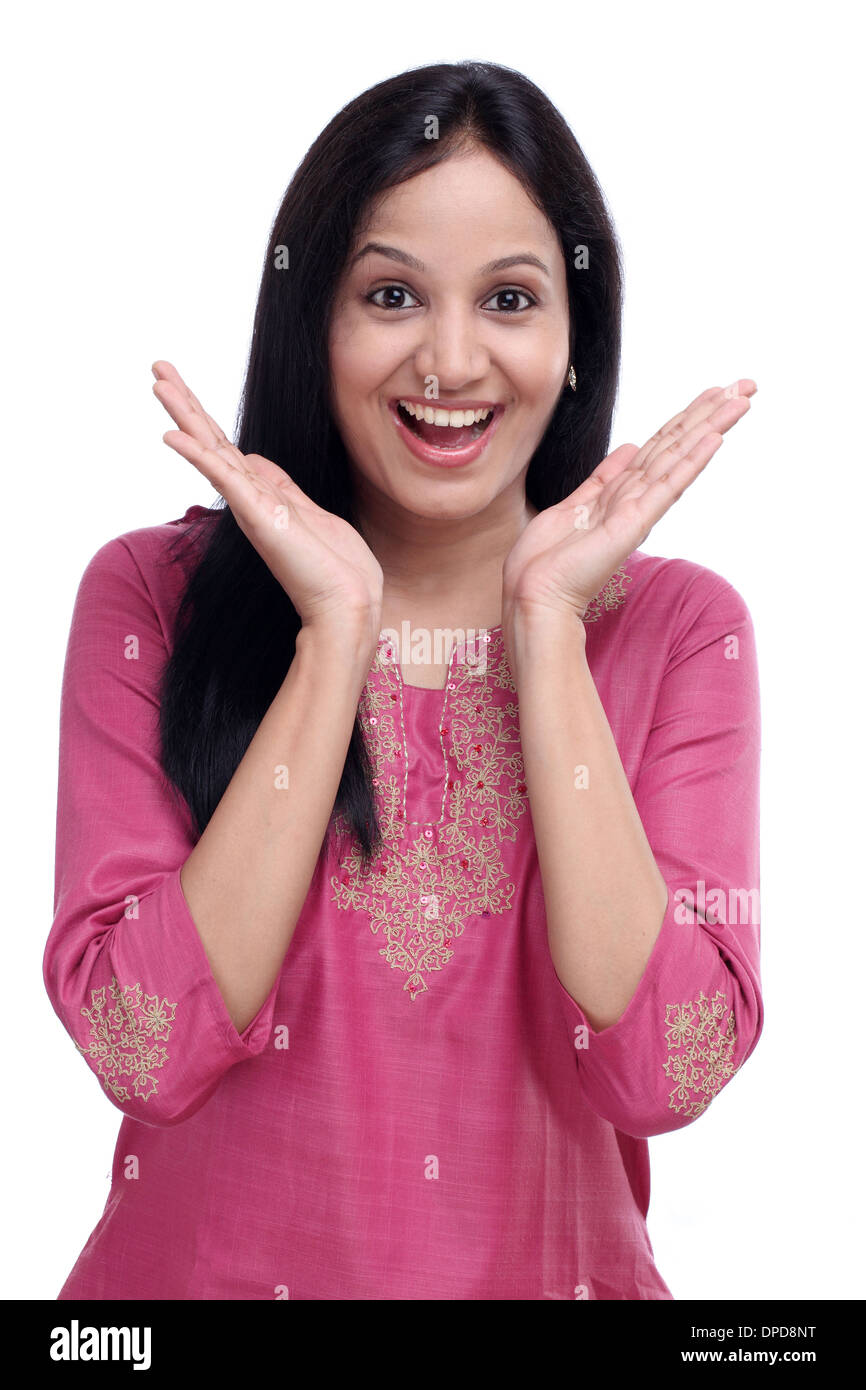 Surprised young indian woman against white background Stock Photo - Alamy