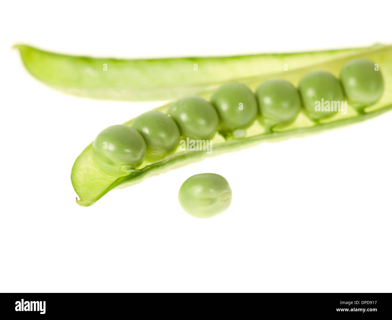 Peas in a pod isolated on white background Stock Photo - Alamy