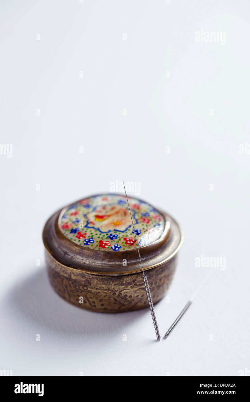 Acupuncture needles and pill box, close up Stock Photo - Alamy