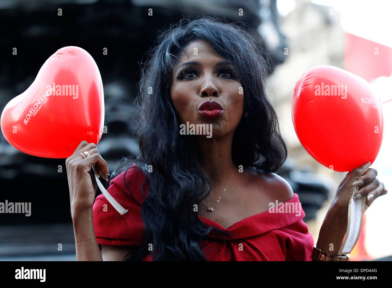 British-American singer Sinitta poses with red balloons for a ...