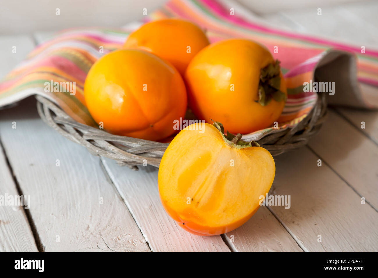 Kaki fruits and sliced Kaki fruit Stock Photo - Alamy