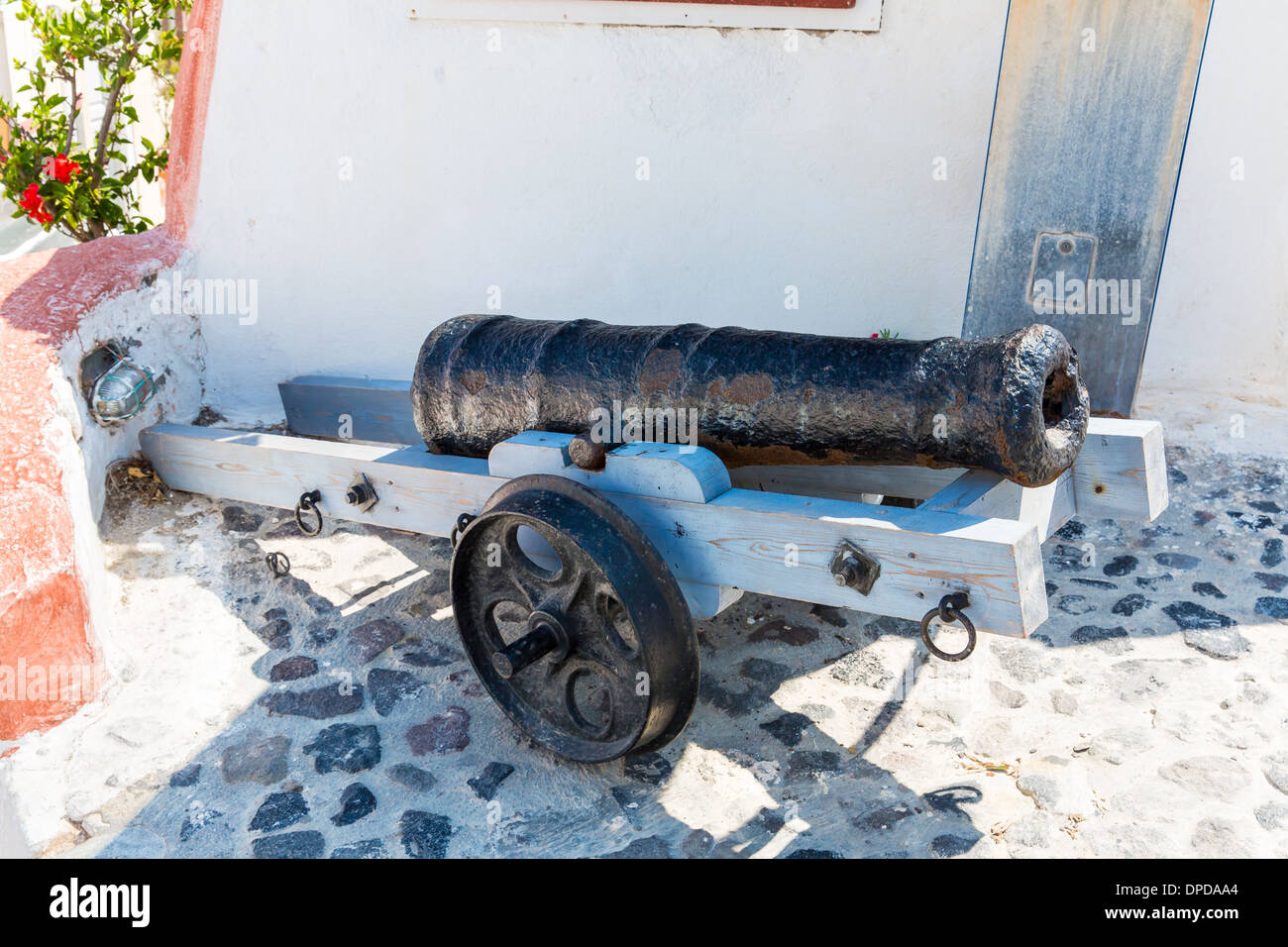 Ancient cannon on Santorini island,Crete,Greece. View of Fira town ...