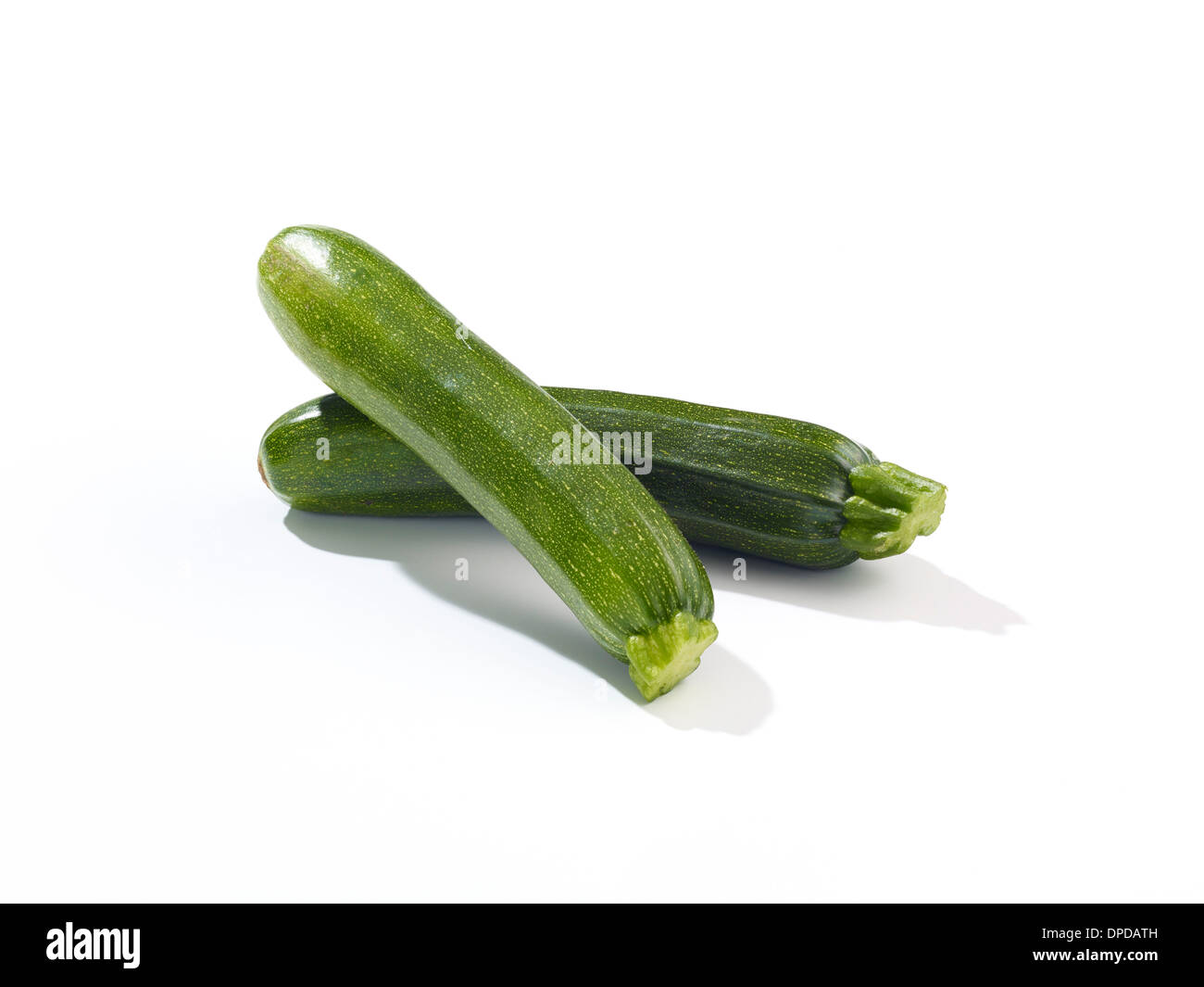 Two courgettes, studio shot Stock Photo - Alamy