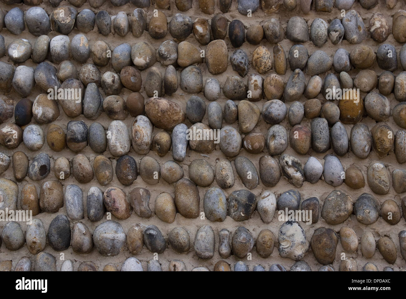 Pebble wall near the Church of St Edmund, a grade II listed medieval ...