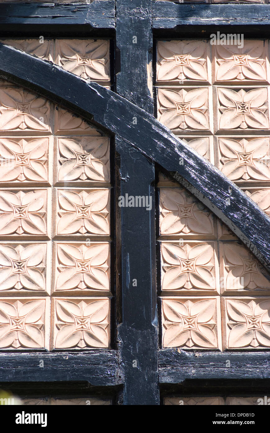 Plaster patterned tiles in a wood timber frame, on a residential ...