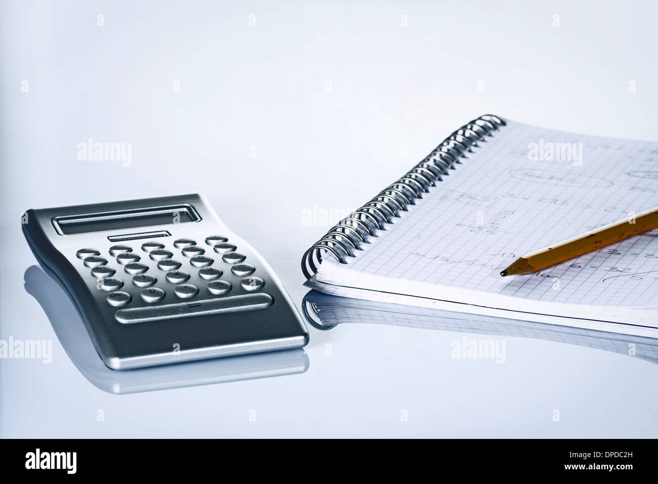 Calculator and note pad Stock Photo - Alamy
